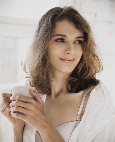 Premium Photo Beautiful Woman Wearing White Lingerie Drinking Coffee In The Mo