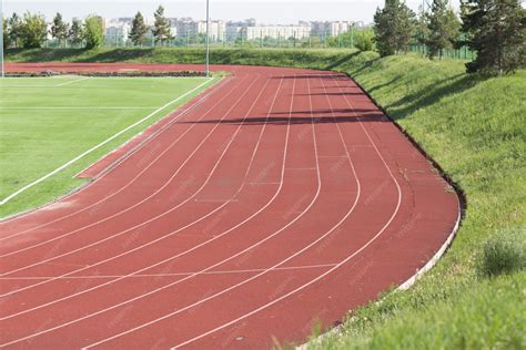 Premium Photo Running Track And Field With Green Grass For Football
