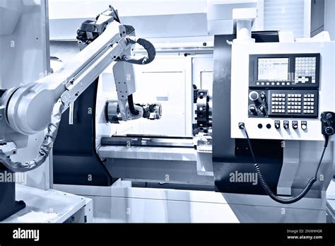 Robotic Arm And Cnc Lathe Machine Stock Photo Alamy