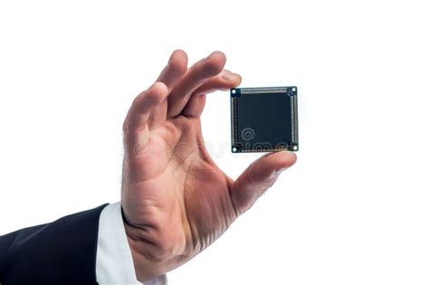 Close Up Of A Hand Presenting Computer Chip With Visible Circuits