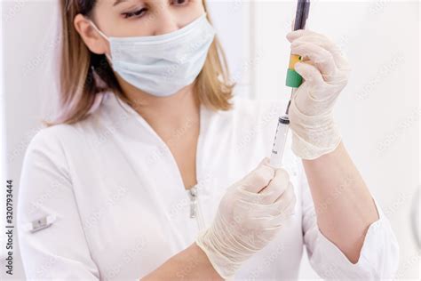 Scientist Holding Test Tube With Blood In Laboratory Beautiful Female Chemist Looking Analyzing