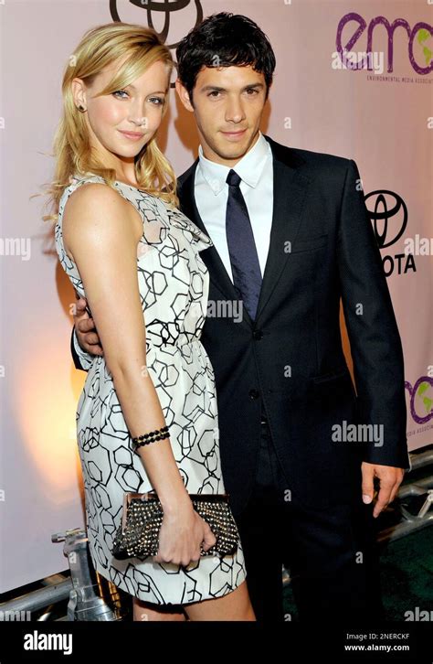 Actors Katie Cassidy Left And Michael Rady Attend The 20th