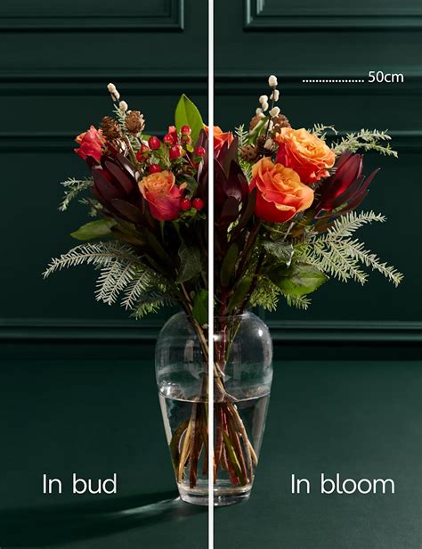 Orange Rose And Festive Foliage Bouquet Mands