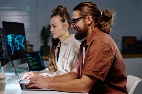 Premium Photo Side View Of Young Male It Engineer Typing On Laptop Keyboard