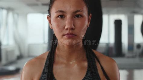 Powerful And Determined Intense Close Up Portrait Of Sweaty Asian Girl