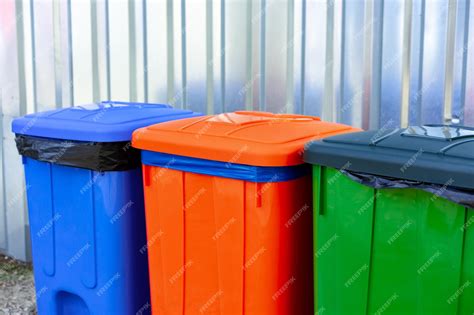 Premium Photo Color Garbage Bins In The City Street On Metal Background