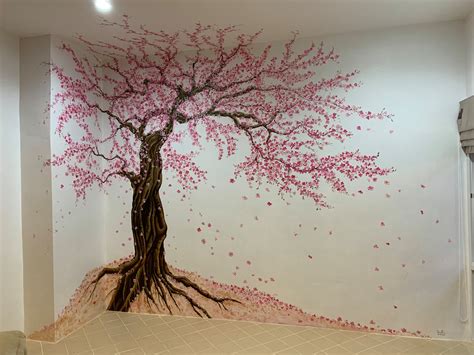 เสร็จเรียบร้อยแล้วครับ งานเพ้นท์ผนังห้องรับแขก ลายต้นดอกซากุระบานสะพรั่ง ณ บ้านลูกค้า ซ สวน