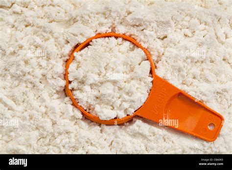 Background And Measuring Scoop Of White Whey Protein Isolate Powder