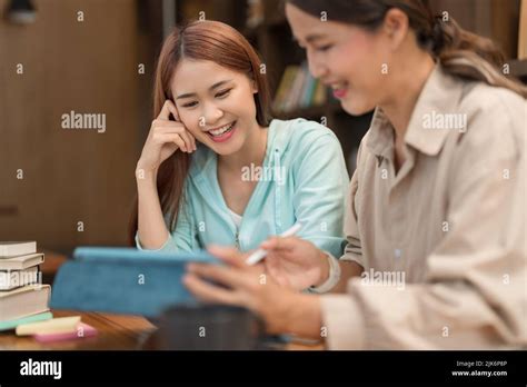 Education Concept Female Tutor Pointing Math Quiz On Tablet And Explaining Math Lesson To