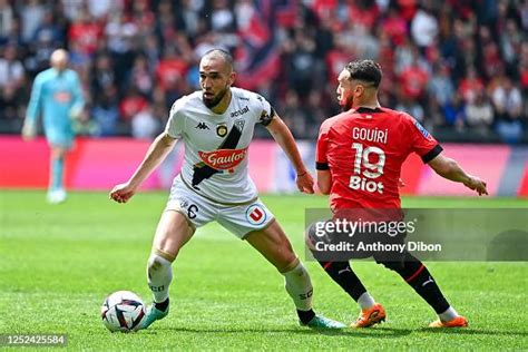 Nabil Bentaleb Of Angers Sco And Amine Gouiri Of Stade Rennais During