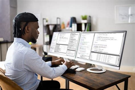 African Coder Using Multiple Computer Screens Stock Photo Image Of