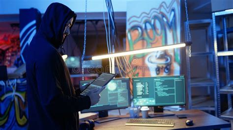 Lone Wolf Hacker In Hideout Trying To Avoid Being Detected Using Tablet Stock Image Image Of