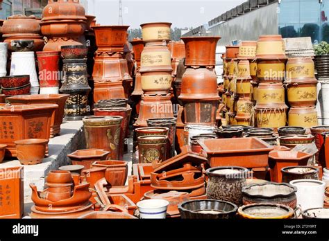 Flowerpot And Flower Gardening Tools Stacked Together In A Shop Stock