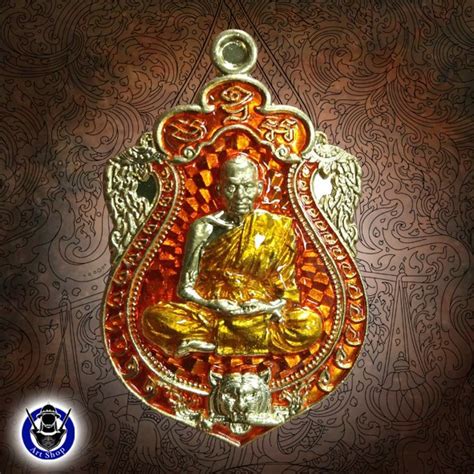 เหรียญเสมาเสือคาบมีดอาถรรพ์ หลวงพ่อพัฒน์ ปุญญกาโม เนื้อทองทิพย์ลงยาส้ม เลขโค้ด ๕๗๒ Shopee Thailand