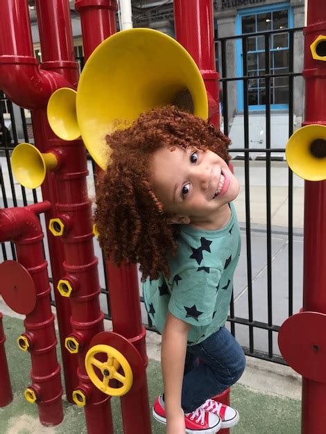Premium Photo Full Length Portrait Of Innocent Girl Standing By Red Pipes