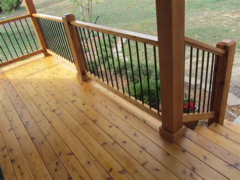Cedar Plank Wooden Deck With Black Iron Railings