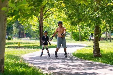 Premium Photo Grandfather And Grandson Enjoying In The Park