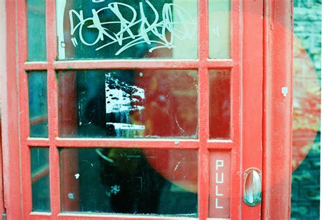 Red Telephone Booth With Graffiti On Glass Photo Free Vintage Image