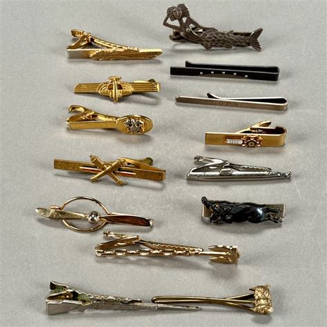 Lot 002 Fourteen Decorative Tie Clips Including Rifle Propeller