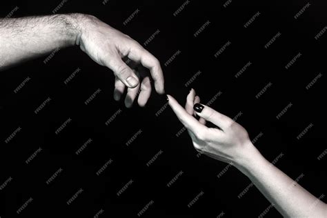 Premium Photo Touch Of Two Hands Man And Woman Hand About To Touch