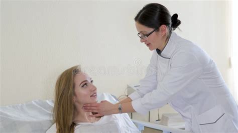 A Female Doctor Examines A Pregnant Girl In The Hospital A