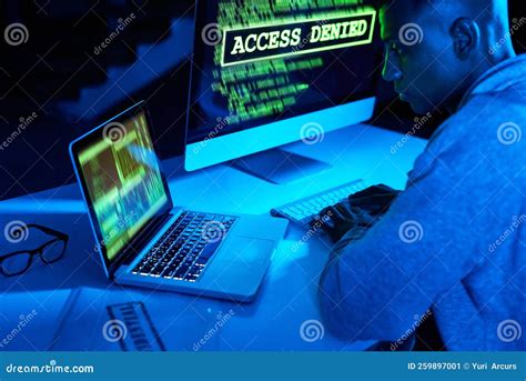 Hes Going To Crack It Soon A Young Male Hacker Cracking A Computer