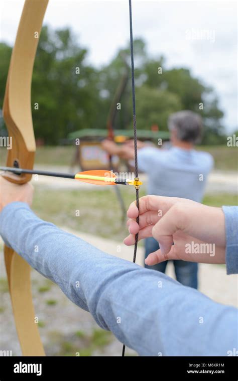 Pulling The String Of A Bow Stock Photo Alamy