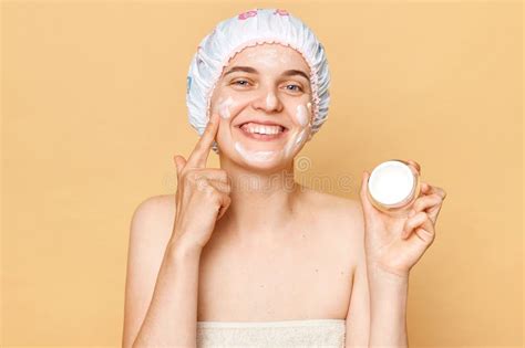 Adorable Smiling Woman Applies Moisturising Mask Doing Skin Care