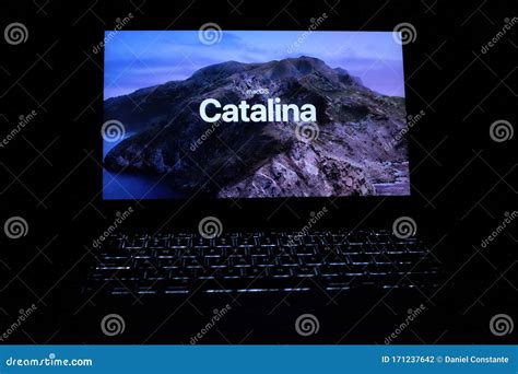 Macbook With The Mac OS Catalina Logo Which Is Apple S Editorial