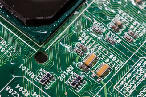 Wet Digital Circuit Board With Microprocessors And Components Closeup