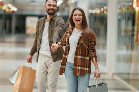 Premium Photo Guy Dont Want To Go For Shopping Young Couple Are In