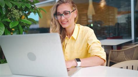 remote work female developer working on laptop sitting terrace cafe stock video video of