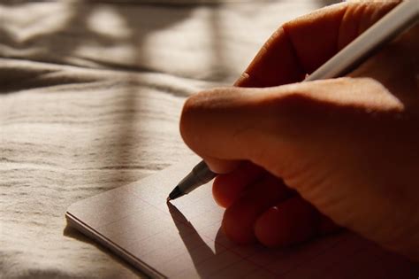 Premium Photo Closeup Shot Of Handwriting Ballpoint Pen White Notebook