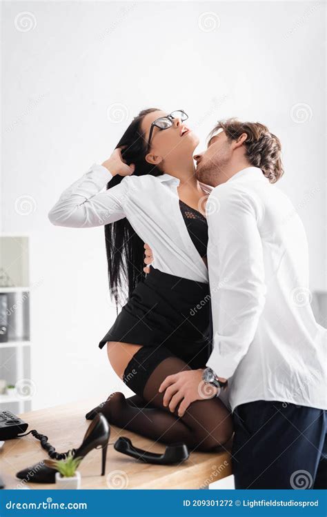 Passionate Businessman Kissing Seductive Secretary In Stock Photo Image Of Business Kiss