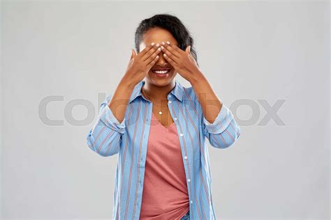 African American Woman With Eyes Closed By Hands Stock Image Colourbox