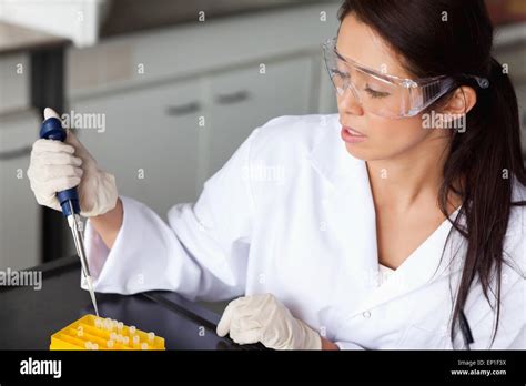 Brunette Woman Making An Experiment Stock Photo Alamy