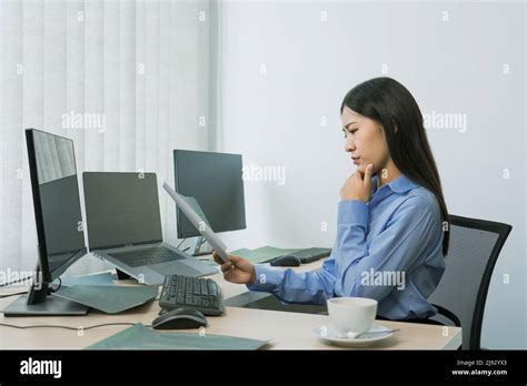 Stress Asian Woman While Coding Data Programmer On Desktop Pc While Working On Computer Codes In