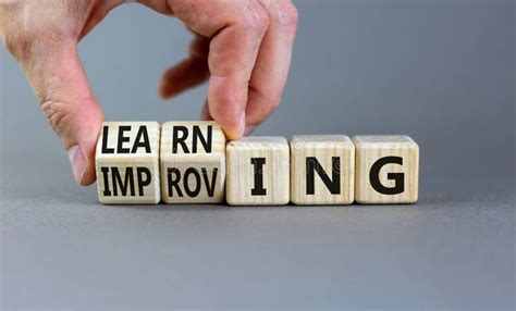 Improving Or Learning Symbol Businessman Turns Wooden Cubes And