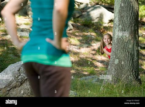 Girl Playing Hide And Seek Stock Photo Alamy