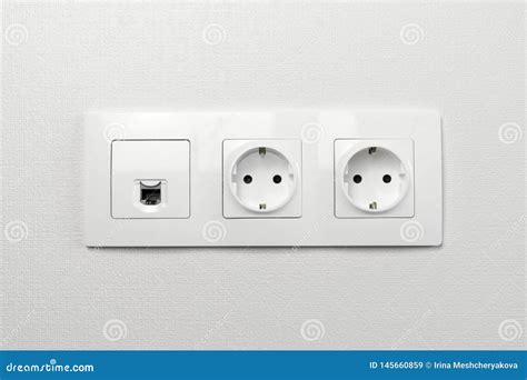 Electrical Sockets On The Wall With Black Connection Internet Plug And White Wire Socket Set