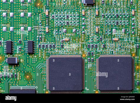 Closeup Of Micro Processor Chip On Motherboard In Computer Green Printed Circuit Board Pcb