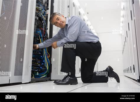 Man Fixing Server Wires Stock Photo Alamy