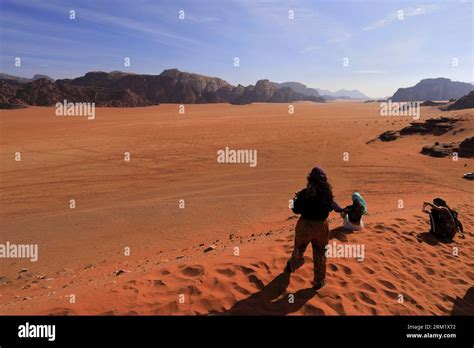 Tourists At Al Ramal Red Sand Dune Wadi Rum Unesco World Heritage