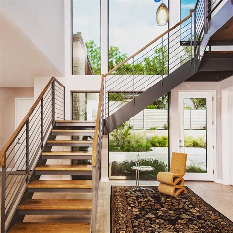 Steel And Hickory Wood Stairs Highlight This Two Story Entry