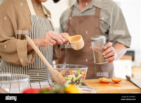 Happy Asian Couples Husband And Wife Are Cooking A Healthy Salad Bowl