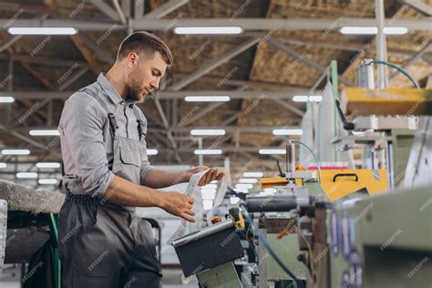 Premium Photo Factory Male Bearded Worker Is Programming A Cnc