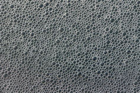 Bubbles Forming An Intricate Pattern On A Surface During A Creative