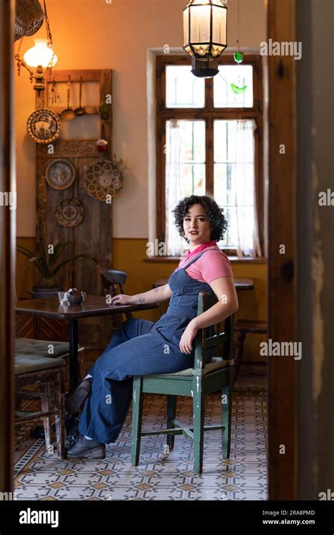 Portrait Of A Smiling Brunette Girl Of Twenty Five Years Old Dressed In A Vintage Pink Blouse