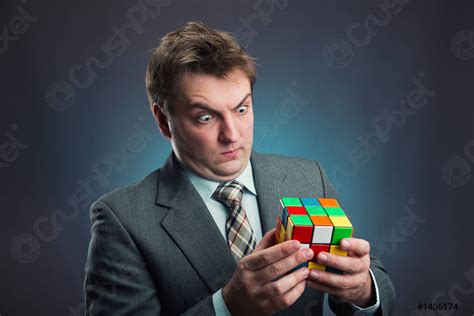 Businessman Holding Rubik Cube In His Hands Stock Photo Crushpixel