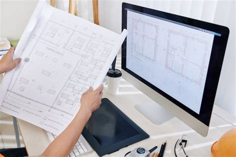 Premium Photo Architect Comparing Blueprints